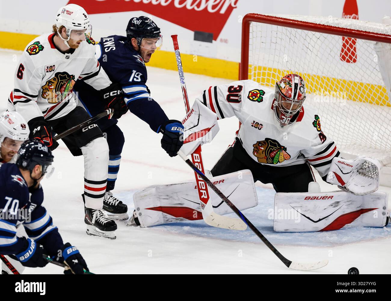Chicago Blackhawks' Sam Rinzel (6) defends against Winnipeg Jets ...