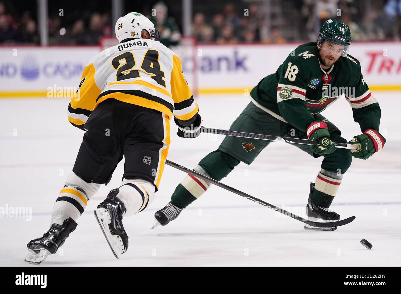 Pittsburgh Penguins defenseman Mathew Dumba (24) and Minnesota Wild ...