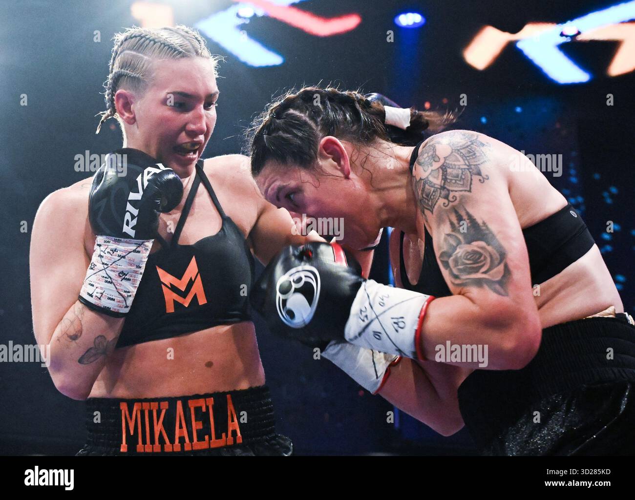 Mikaela Mayer, left, lands a blow to Mary Spencer during their WBA, WBO ...