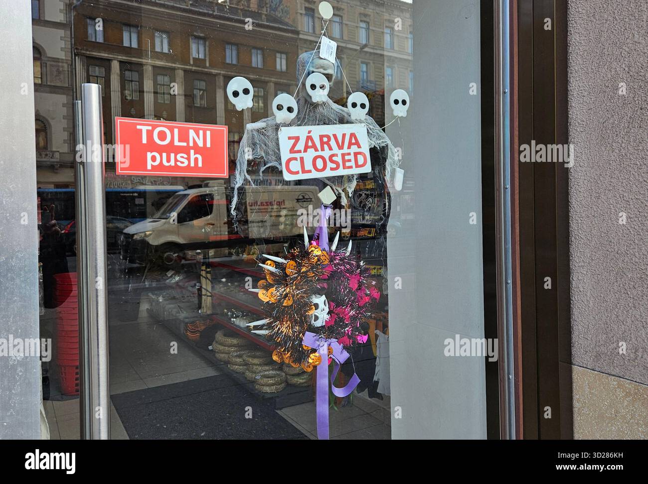 Spooky Halloween skull decoration and "push" and "closed" sign in a ...