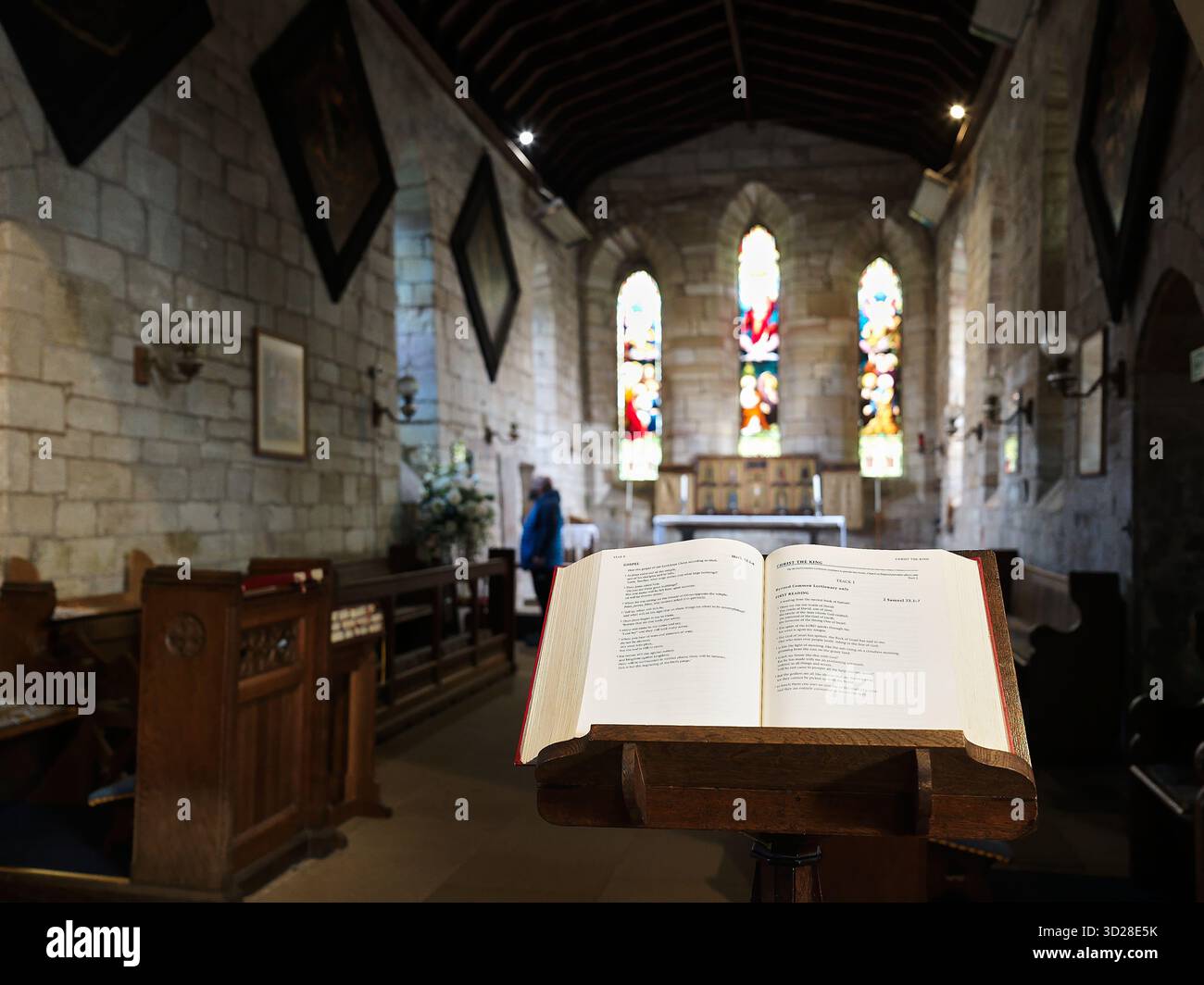 Open Bible on a lectern at the sanctuary in the christian church of ...
