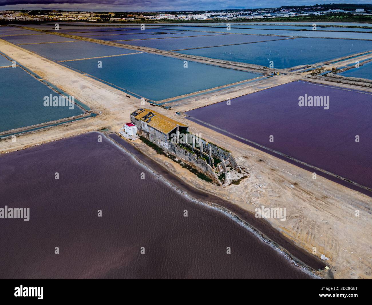 Aerial view of the salt evaporation ponds, a mosaic of colors and ...