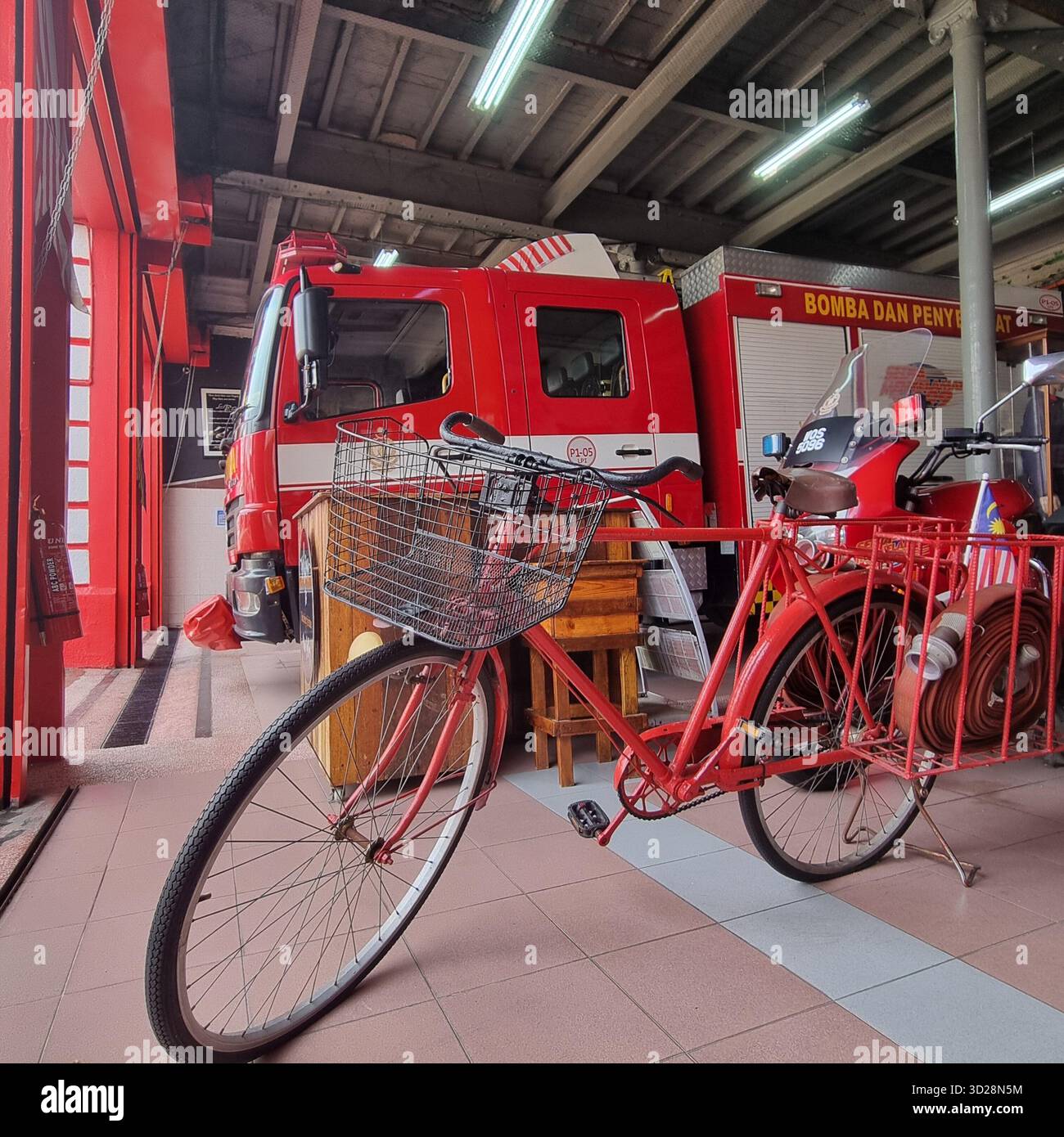 Red Fire Fighting Bicycle Street Art in Penang Malaysia Stock Photo - Alamy
