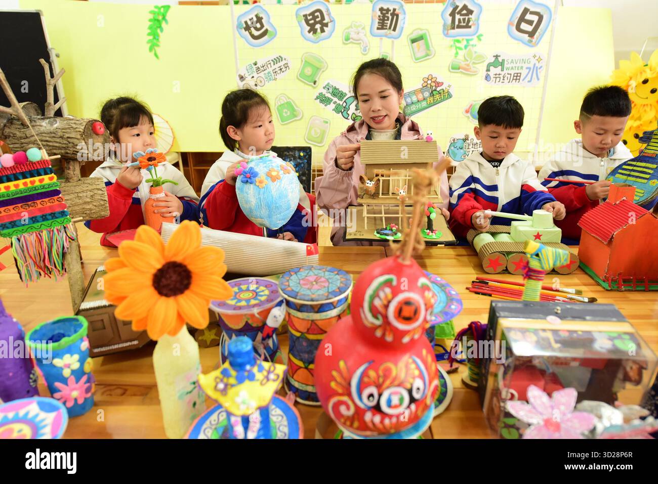 Children learn to make handicrafts with used materials to celebrate the ...