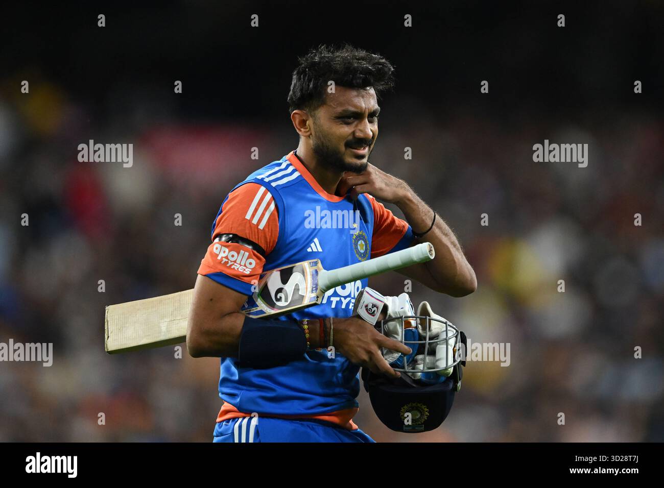 Axar Patel of India exits the field after being run out by Tim David of ...