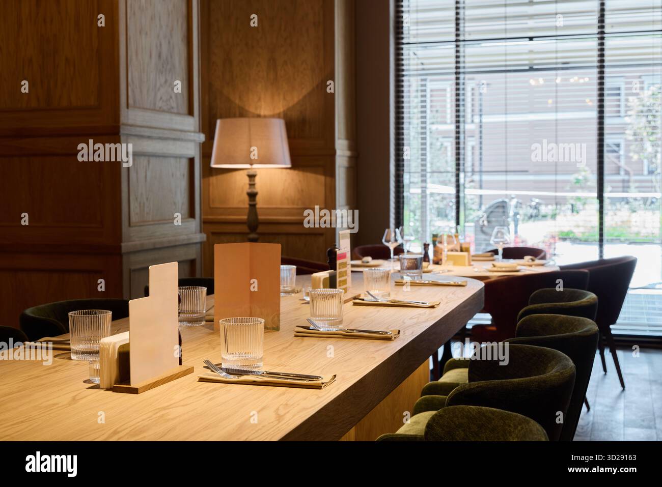 Elegant dining setup in a modern restaurant with natural light Stock ...