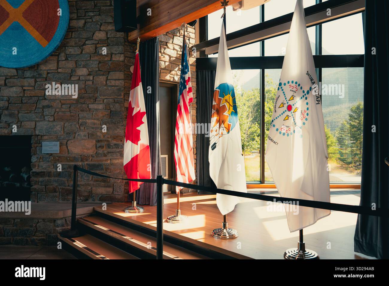 Indoor display of flags. Canada, USA, and indigenous nations united ...