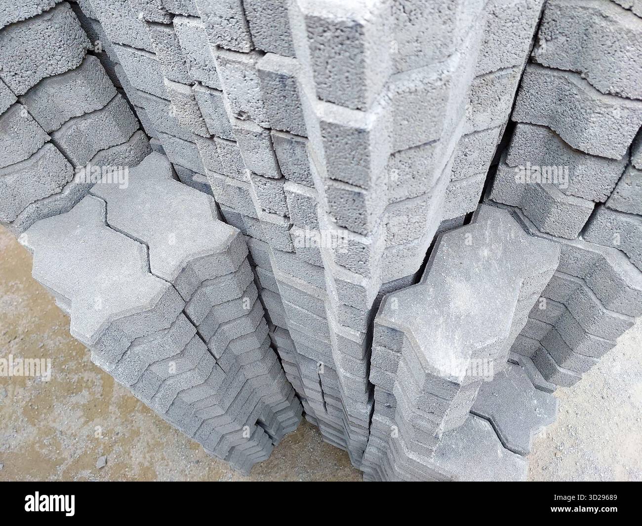 Many cement brick flooring are stacked in construction supply stores ...