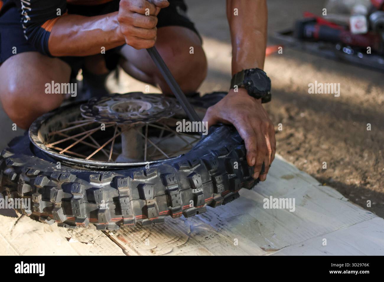 Selective Focus: New motocross tires are being pryed out with a tire ...