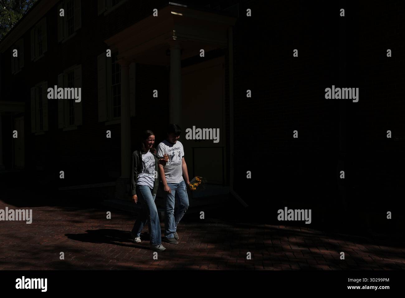 Newlywed couple, Emily Philbrook and Benjamin Barger, walk out of a ...