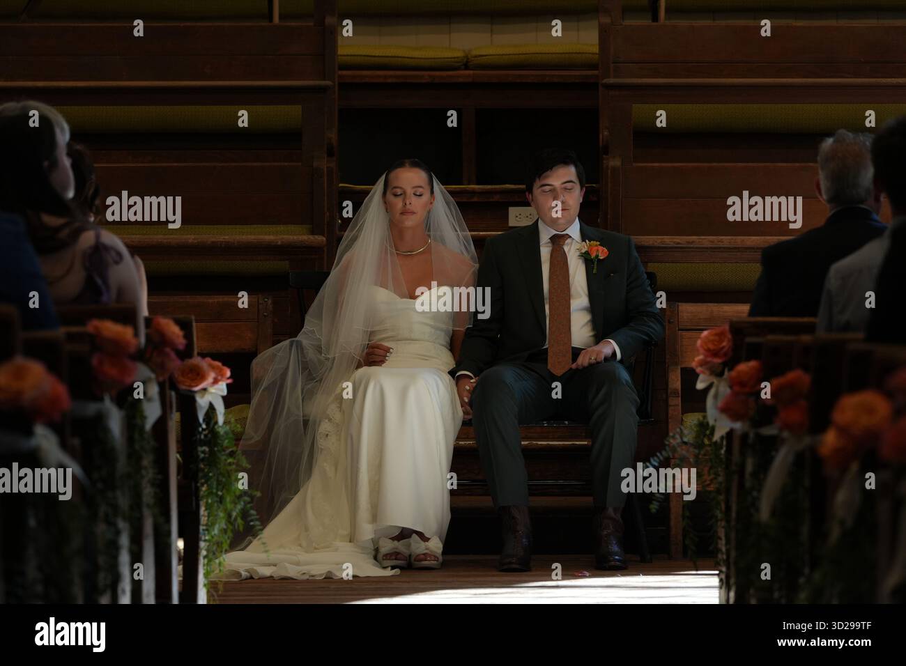Emily Philbrook and Benjamin Barger hold a moment of silence during ...