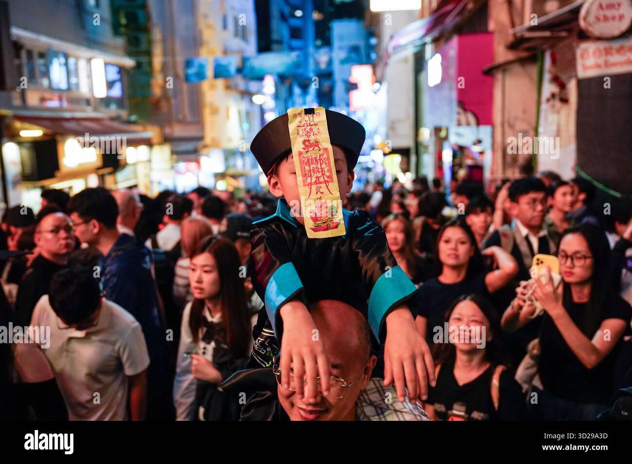 A boy dress as a chinese ghost at Lan Kwai Fong a popular bar district ...