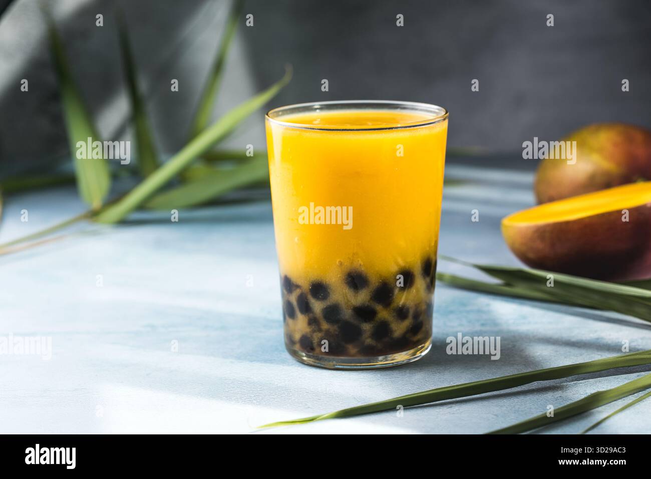 Refreshing mango lassi smoothie with boba pearls, creamy tropical drink ...