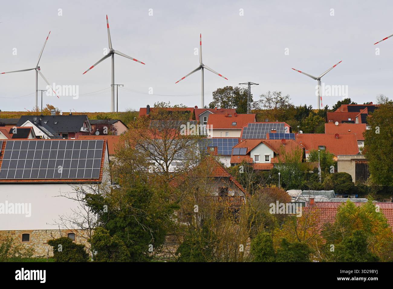Wind turbines in Rhineland-Palatinate behind a village, rooftops with ...