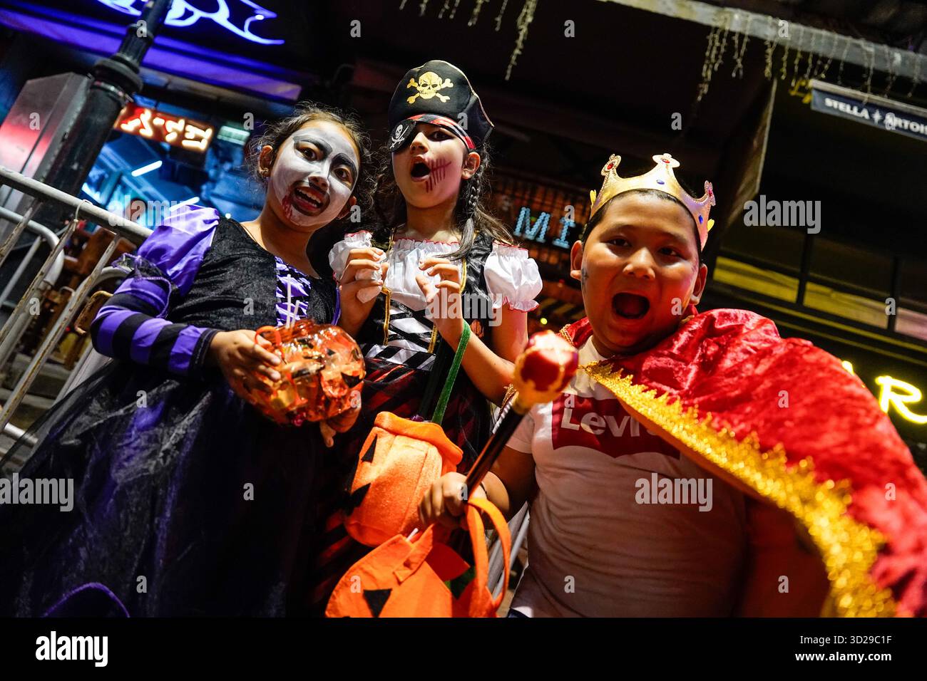 Children dress in costumes posing for a photo at Lan Kwai Fong a ...