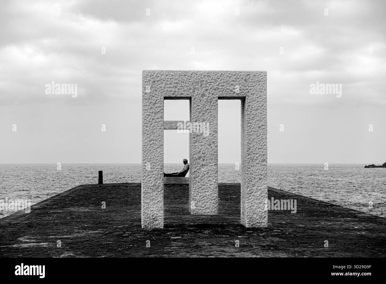 Garachico, Tenerife, Spain: a man sits inside the white marble ...
