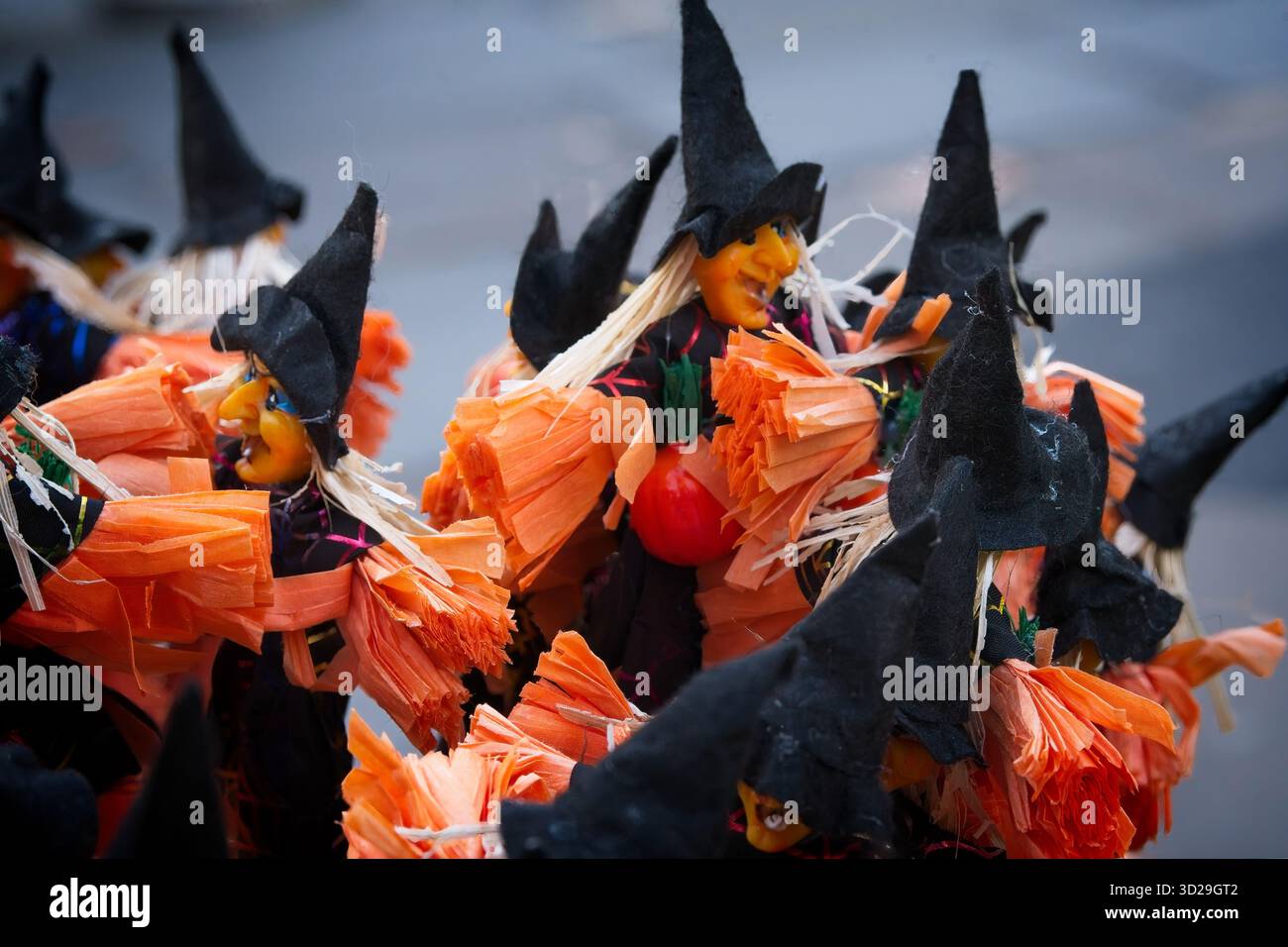 Witch Halloween decorations with orange tissue paper pumpkins and black ...
