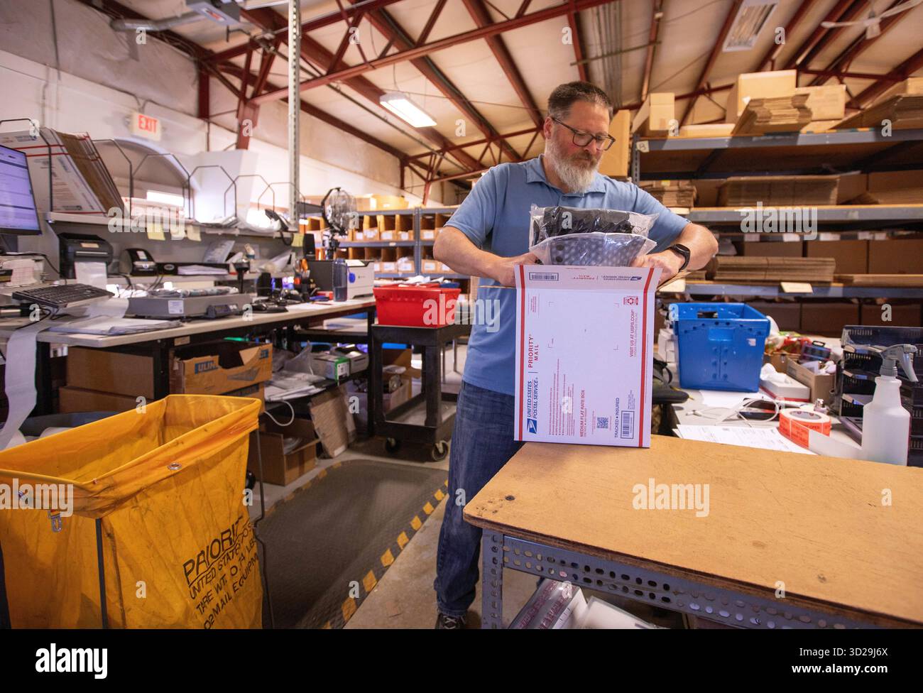 Terry Precision Cycling warehouse manager Luke Tremble packs orders at ...