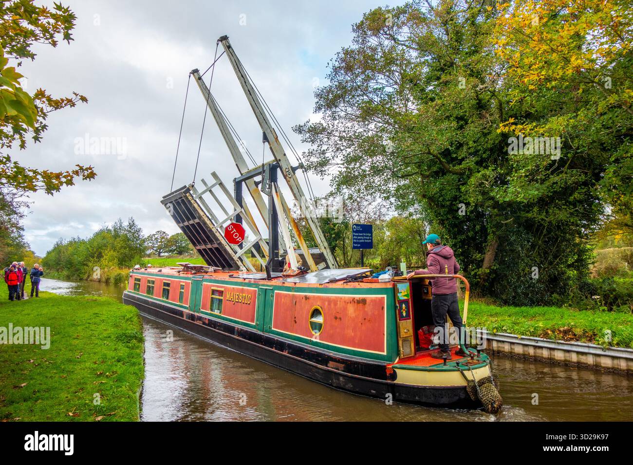 Canal narrowboat passing under a lift bridge on the Llangollen canal at ...
