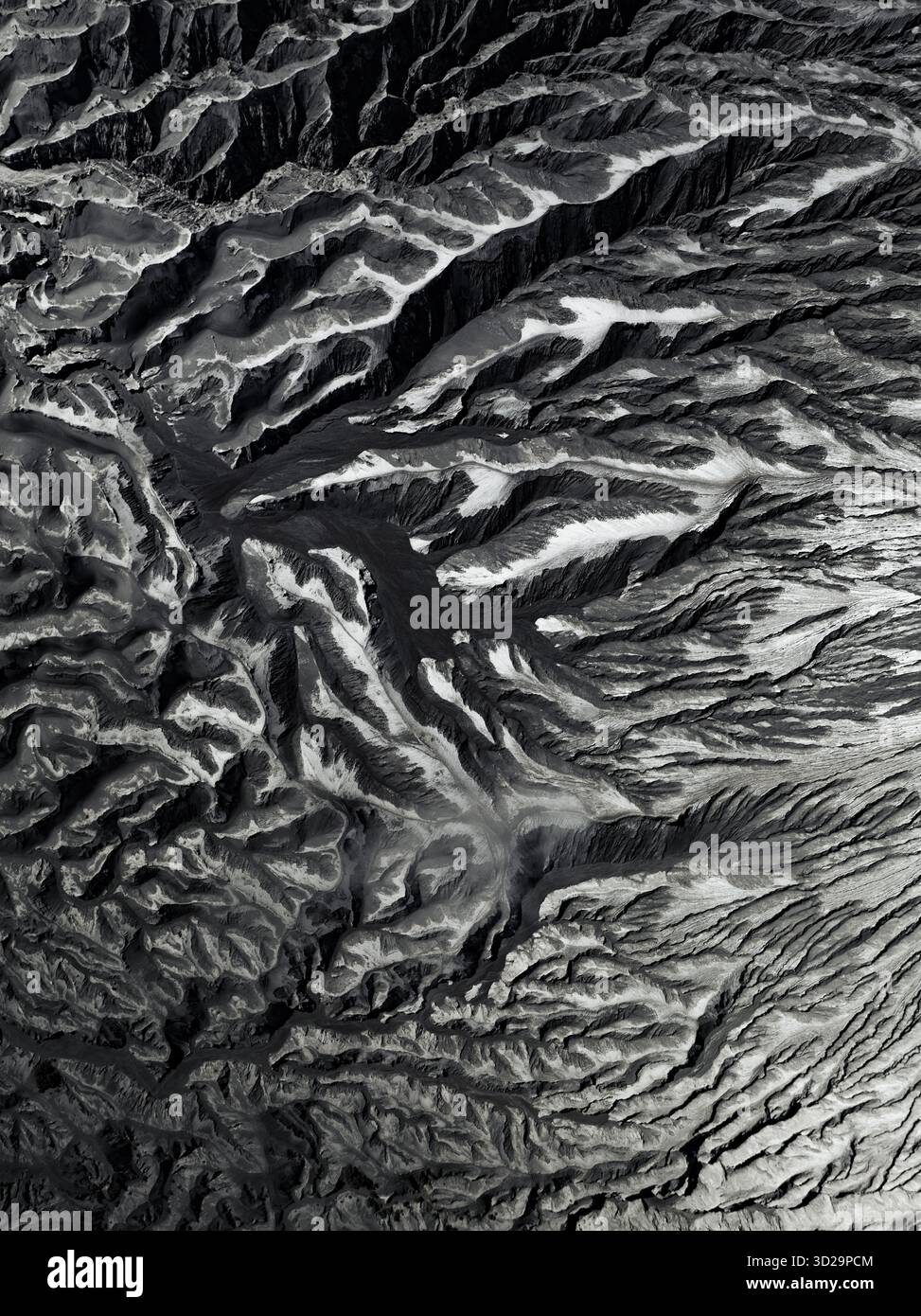 Aerial view of a stark, monochrome landscape revealing the textured ...