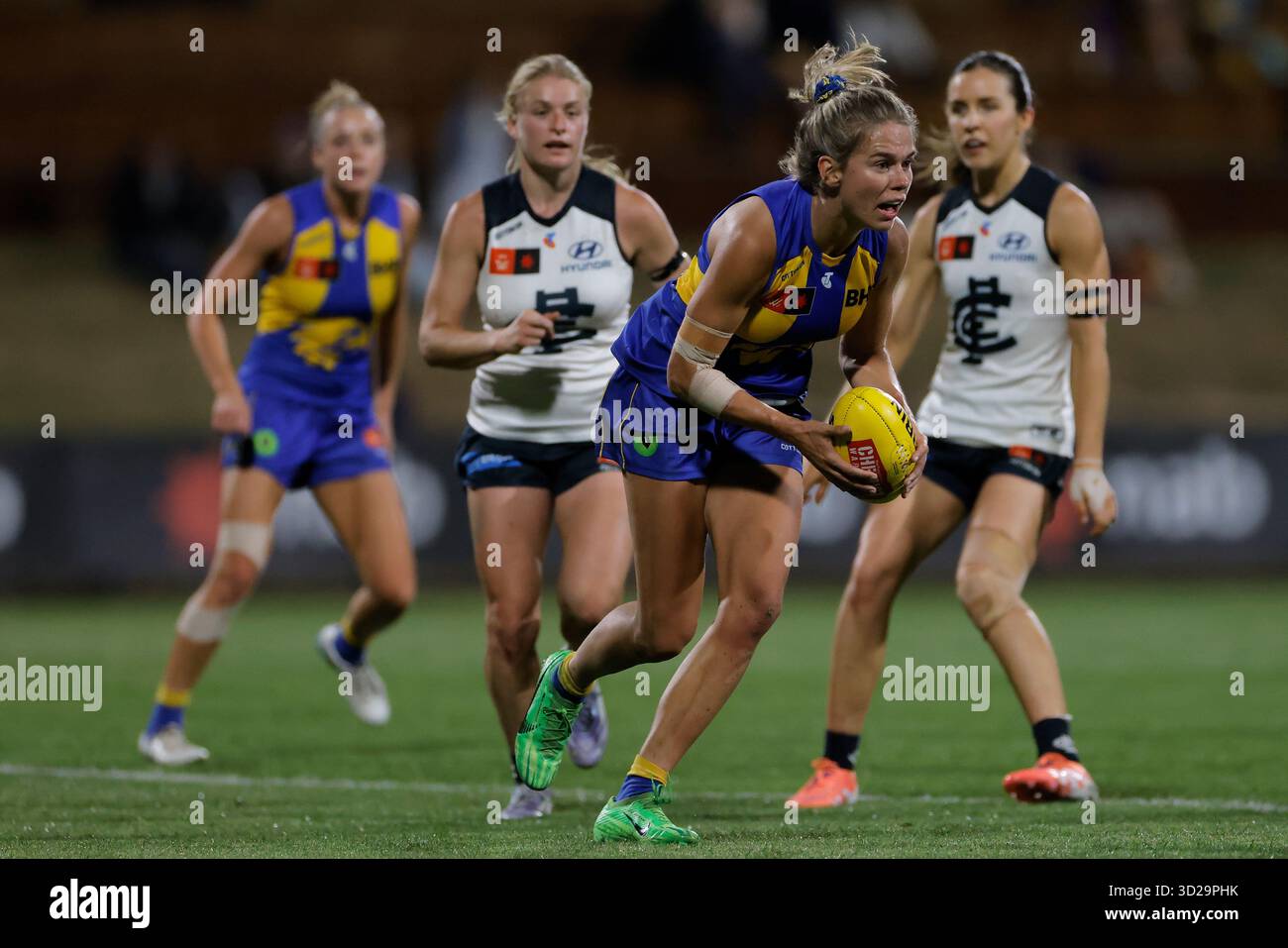 Ella Roberts of the Eagles handballs during the AFLW Round 12 match ...