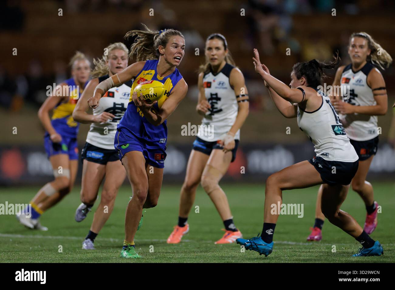 Ella Roberts of the Eagles handballs during the AFLW Round 12 match ...