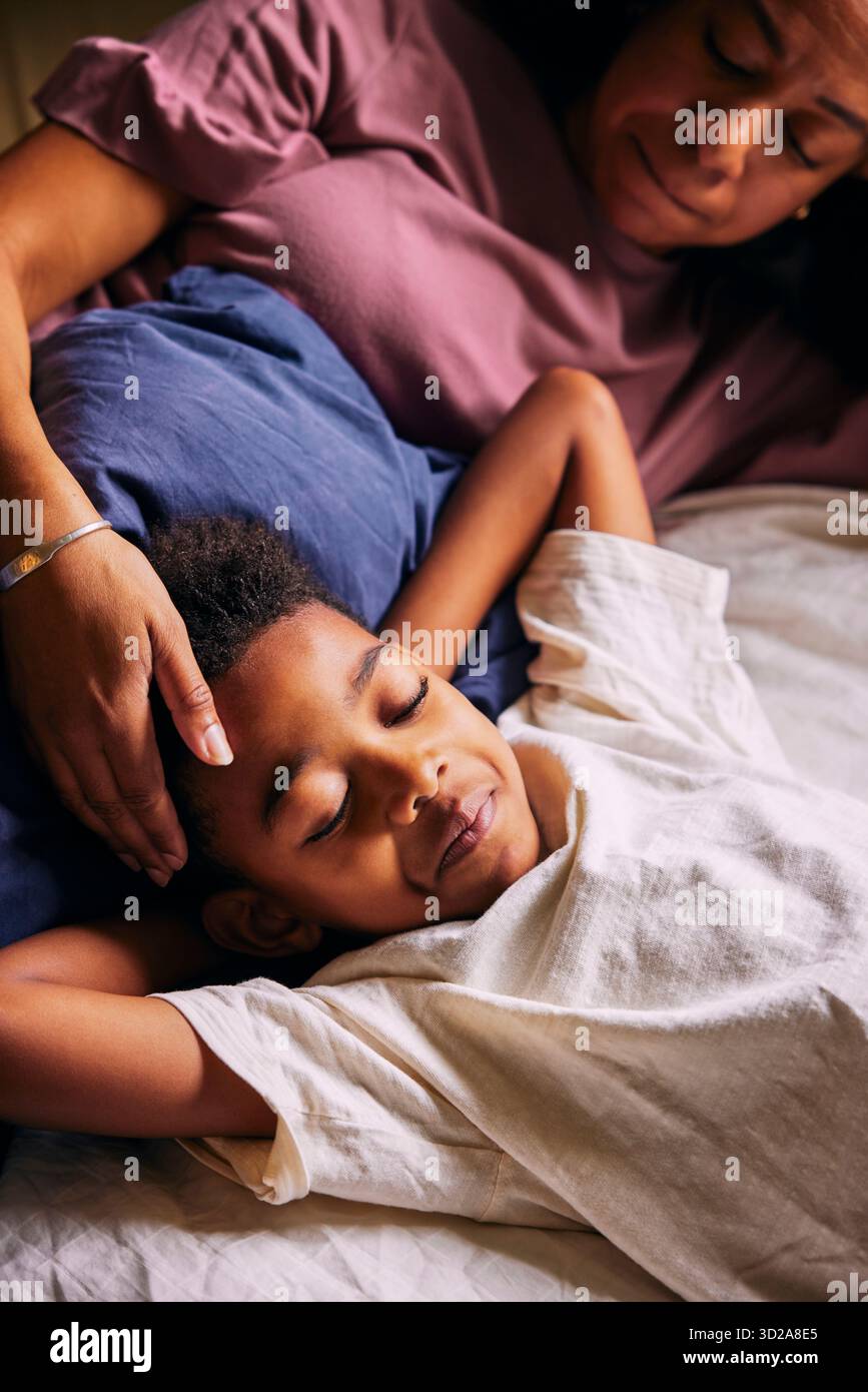 Caring mother caressing head hi-res stock photography and images - Alamy