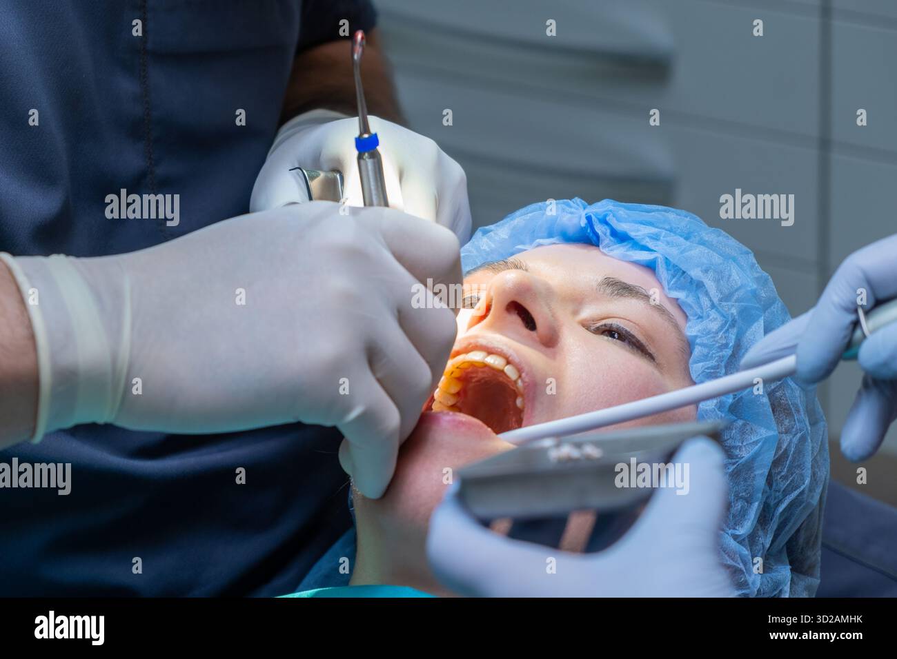 Dental professional works forceps hi-res stock photography and images ...