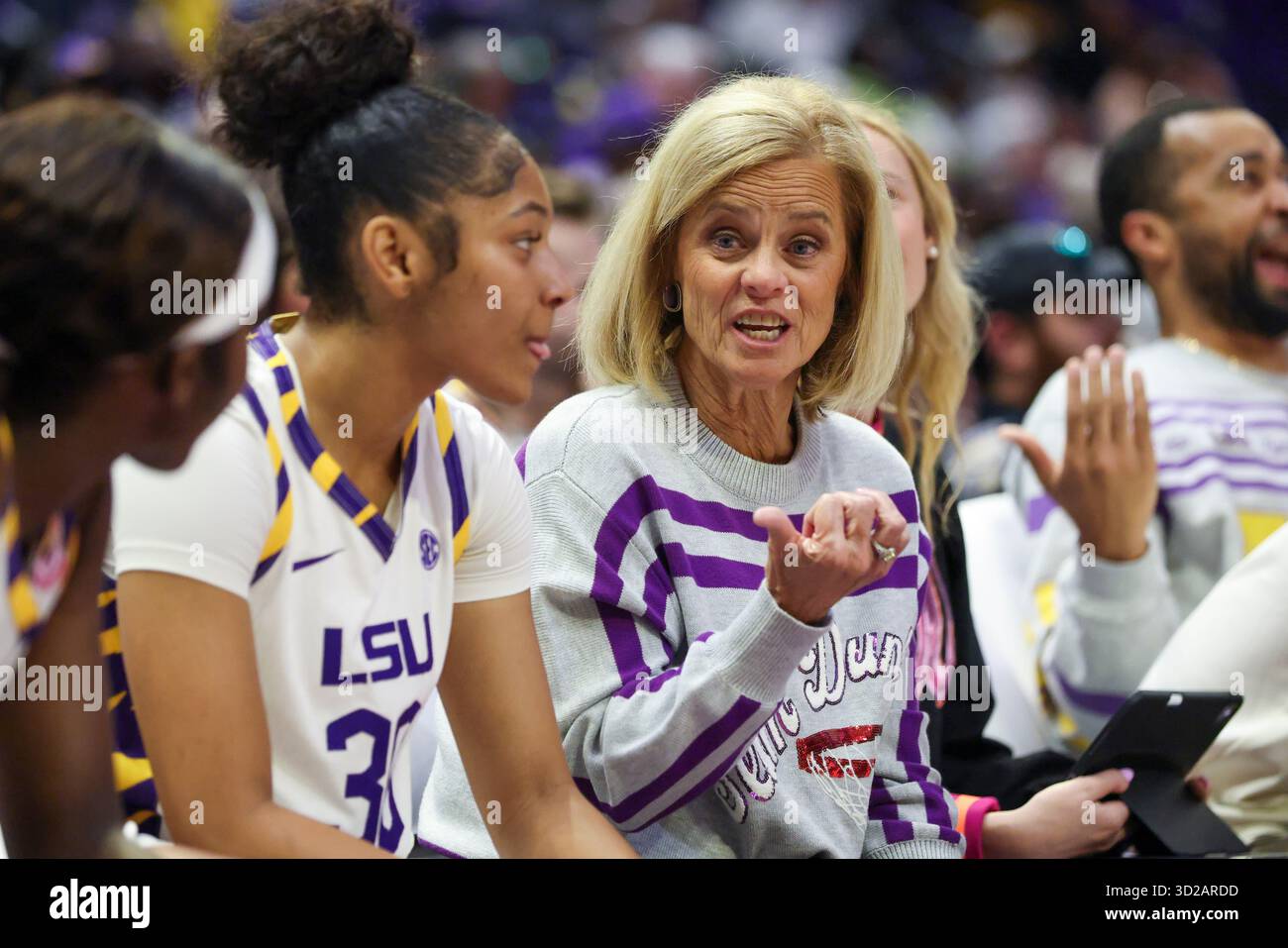 LSU Tigers head coach Kim Mulkey talk to her players while on the bench ...