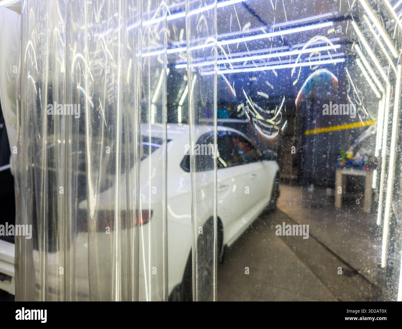 White car being cleaned in a detailing center Stock Photo - Alamy