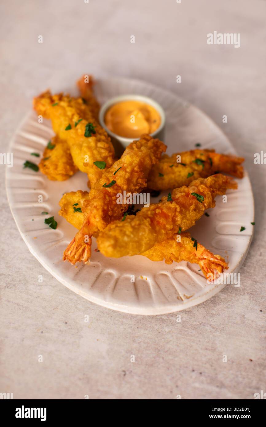 Crispy golden tempura shrimp served fresh and hot, showcasing a light ...