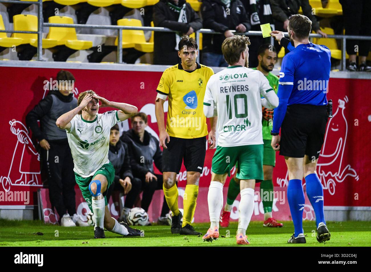 Lommel's Sam De Grand receives a yellow card from the referee during a ...