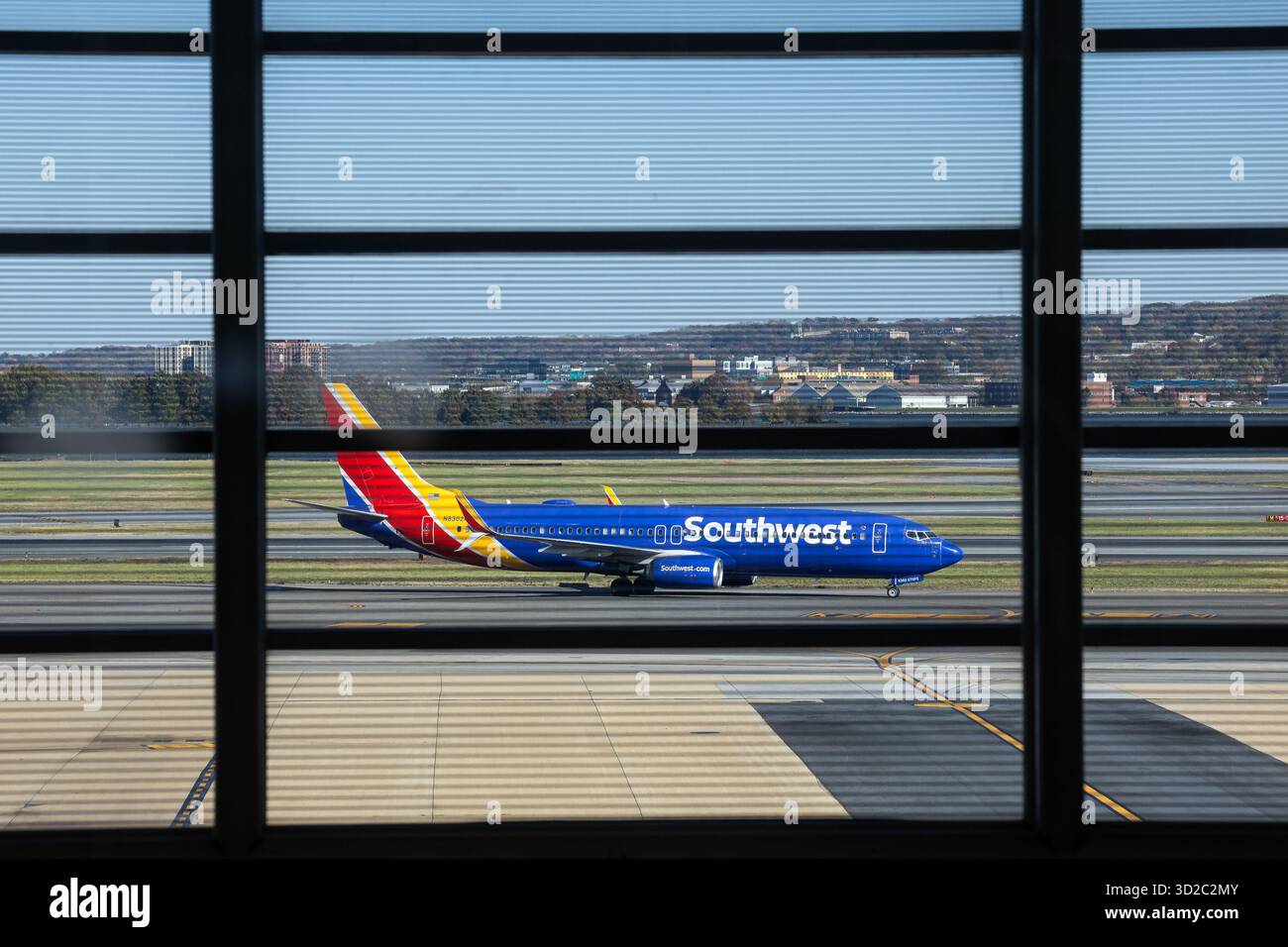 A Southwest Airlines airplane is seen on a runway from inside Ronald ...
