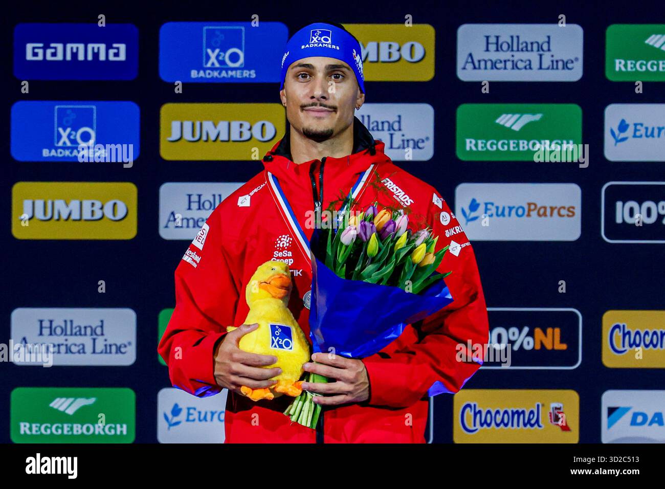 second Sebas Diniz of the Netherlands and Team IKO X2O looks on during the medal ceremony after ...