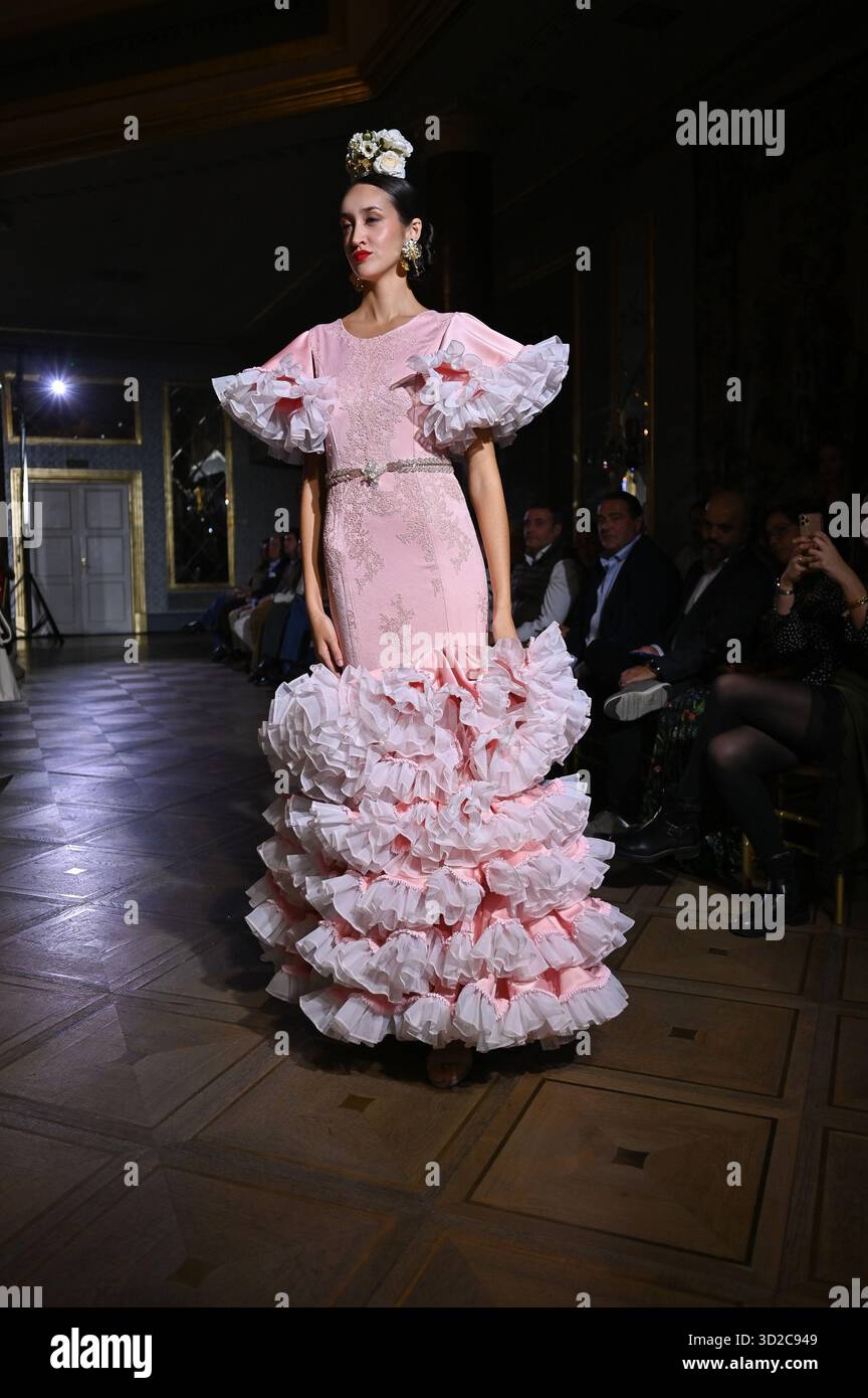 A model walks in a Angela Isa design at the International Flamenco ...