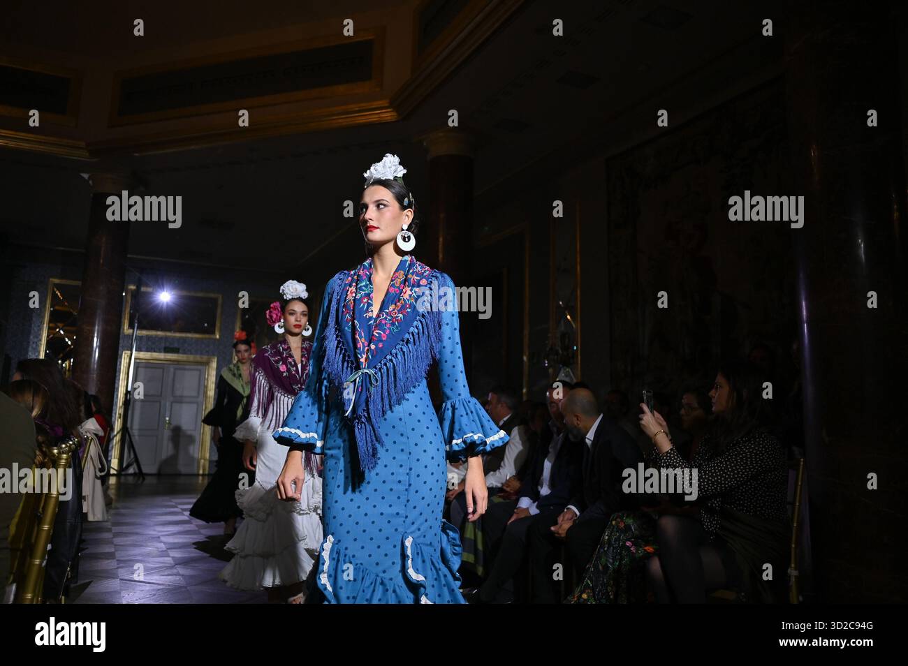 A model walks in a Angela Isa design at the International Flamenco ...