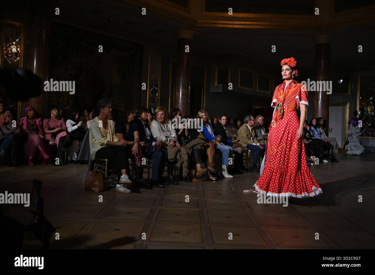 A model walks in a Angela Isa design at the International Flamenco ...