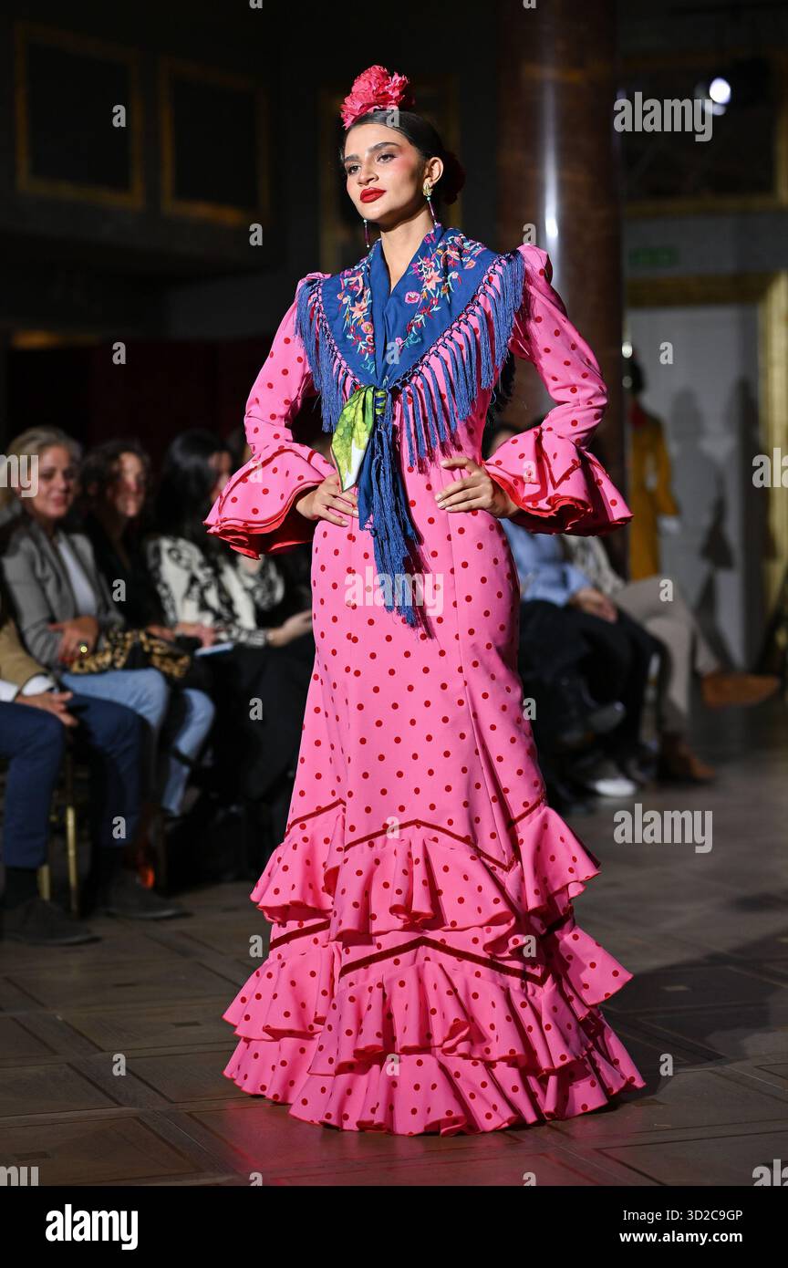 A model walks in a Angela Isa design at the International Flamenco ...