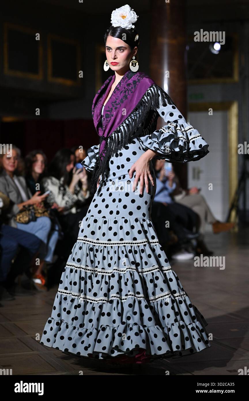 A model walks in a Angela Isa design at the International Flamenco ...