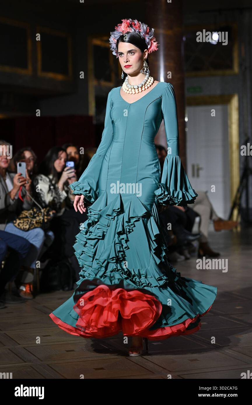 A model walks in a Angela Isa design at the International Flamenco ...