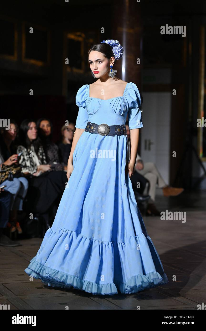A model walks in a Angela Isa design at the International Flamenco ...