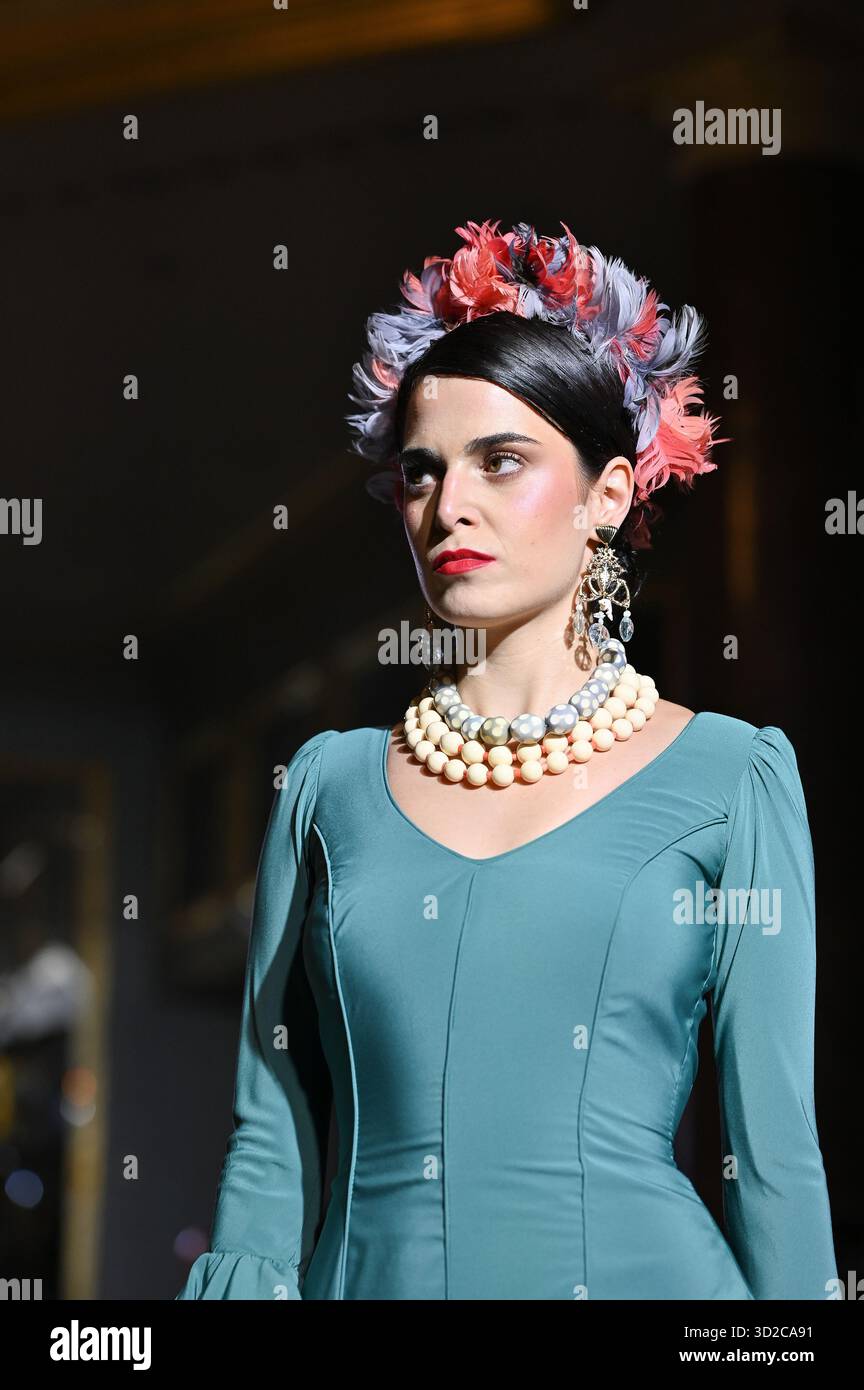 A model walks in a Angela Isa design at the International Flamenco ...