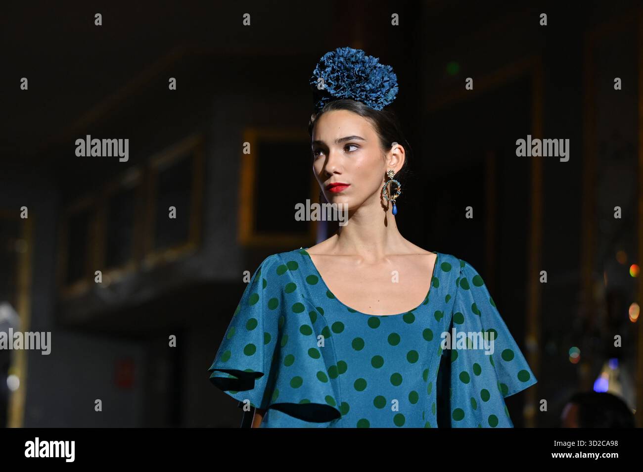 A model walks in a Angela Isa design at the International Flamenco ...