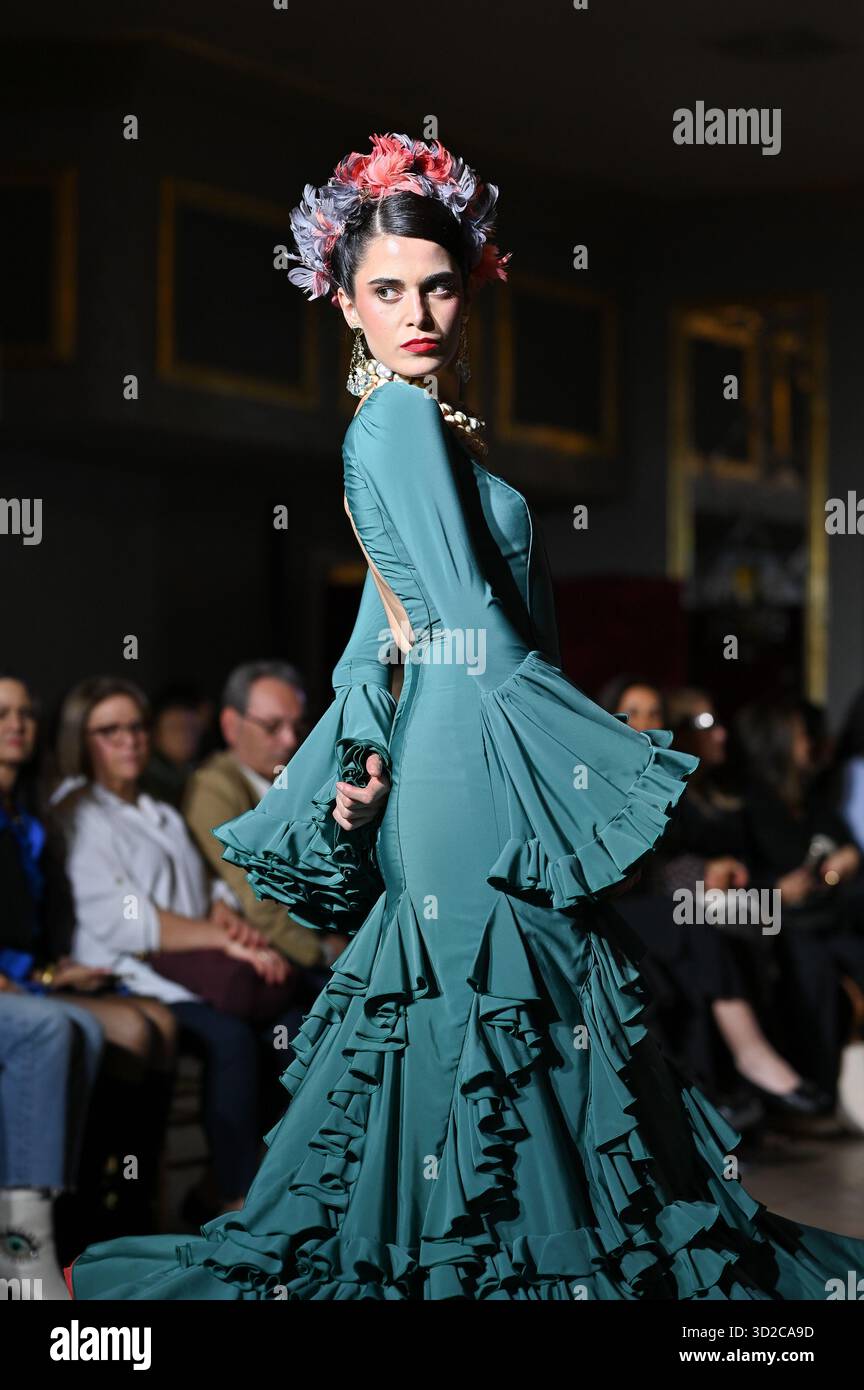 A model walks in a Angela Isa design at the International Flamenco ...