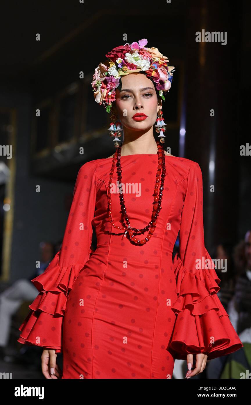 A model walks in a Angela Isa design at the International Flamenco ...
