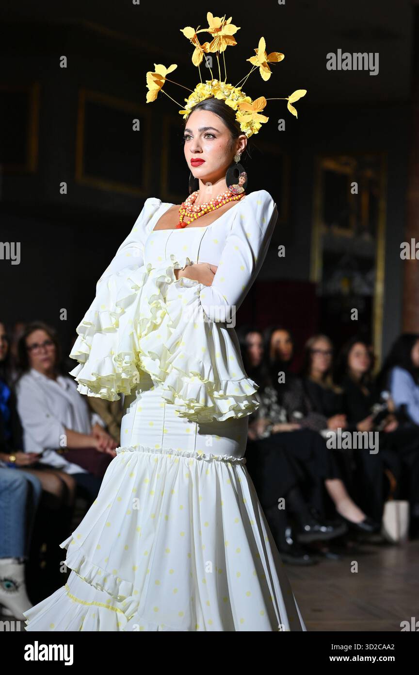 A model walks in a Angela Isa design at the International Flamenco ...