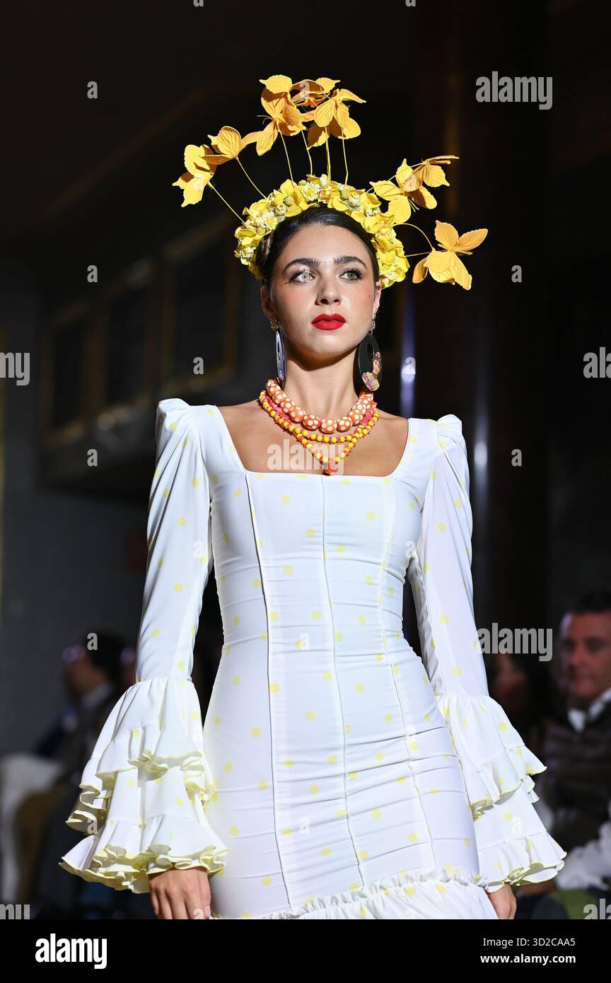 A model walks in a Angela Isa design at the International Flamenco ...