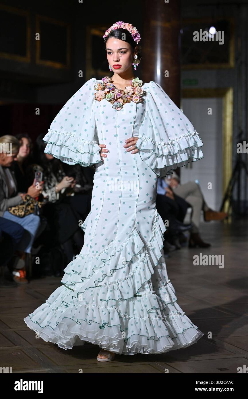 A model walks in a Angela Isa design at the International Flamenco ...