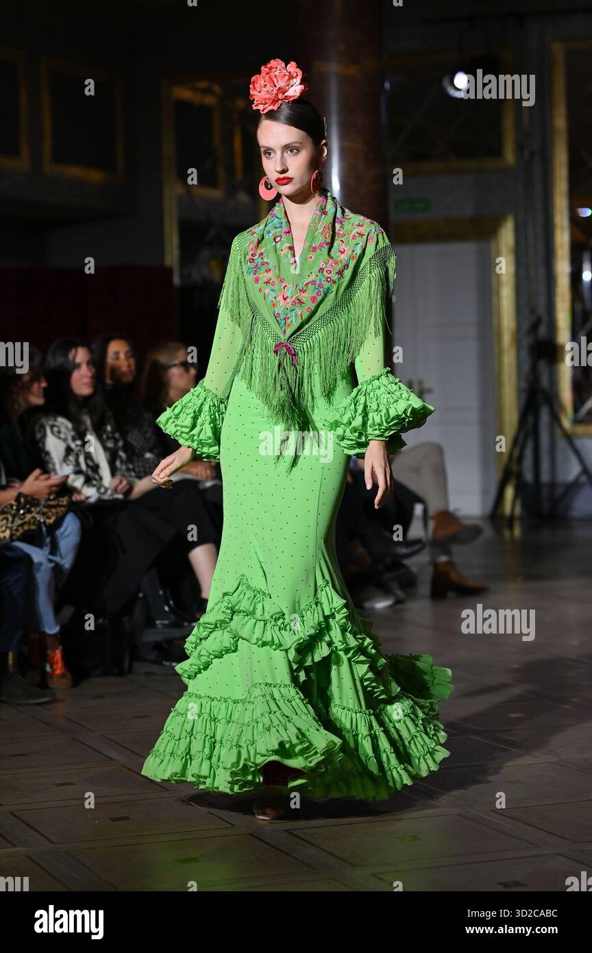A model walks in a Angela Isa design at the International Flamenco ...