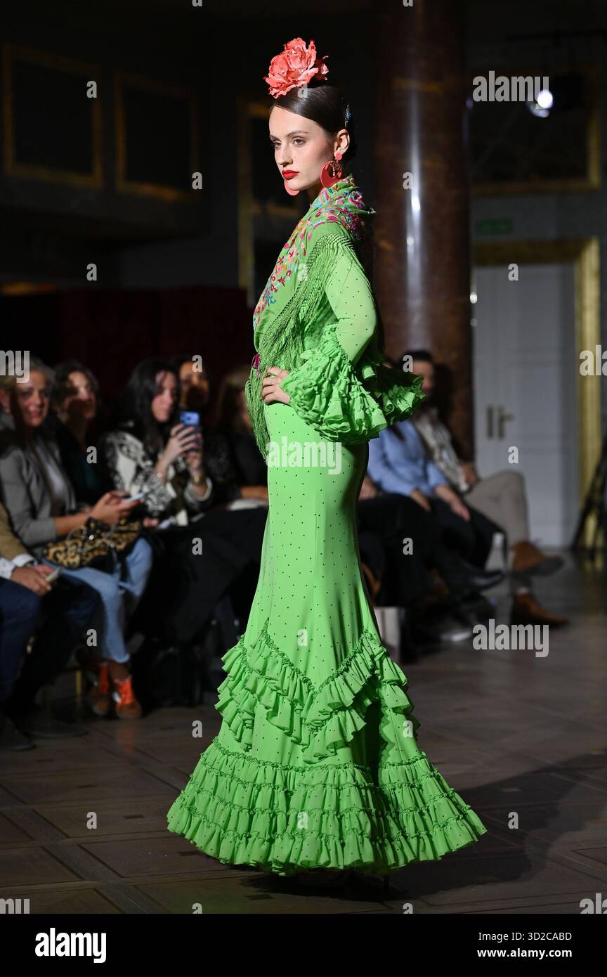 A model walks in a Angela Isa design at the International Flamenco ...